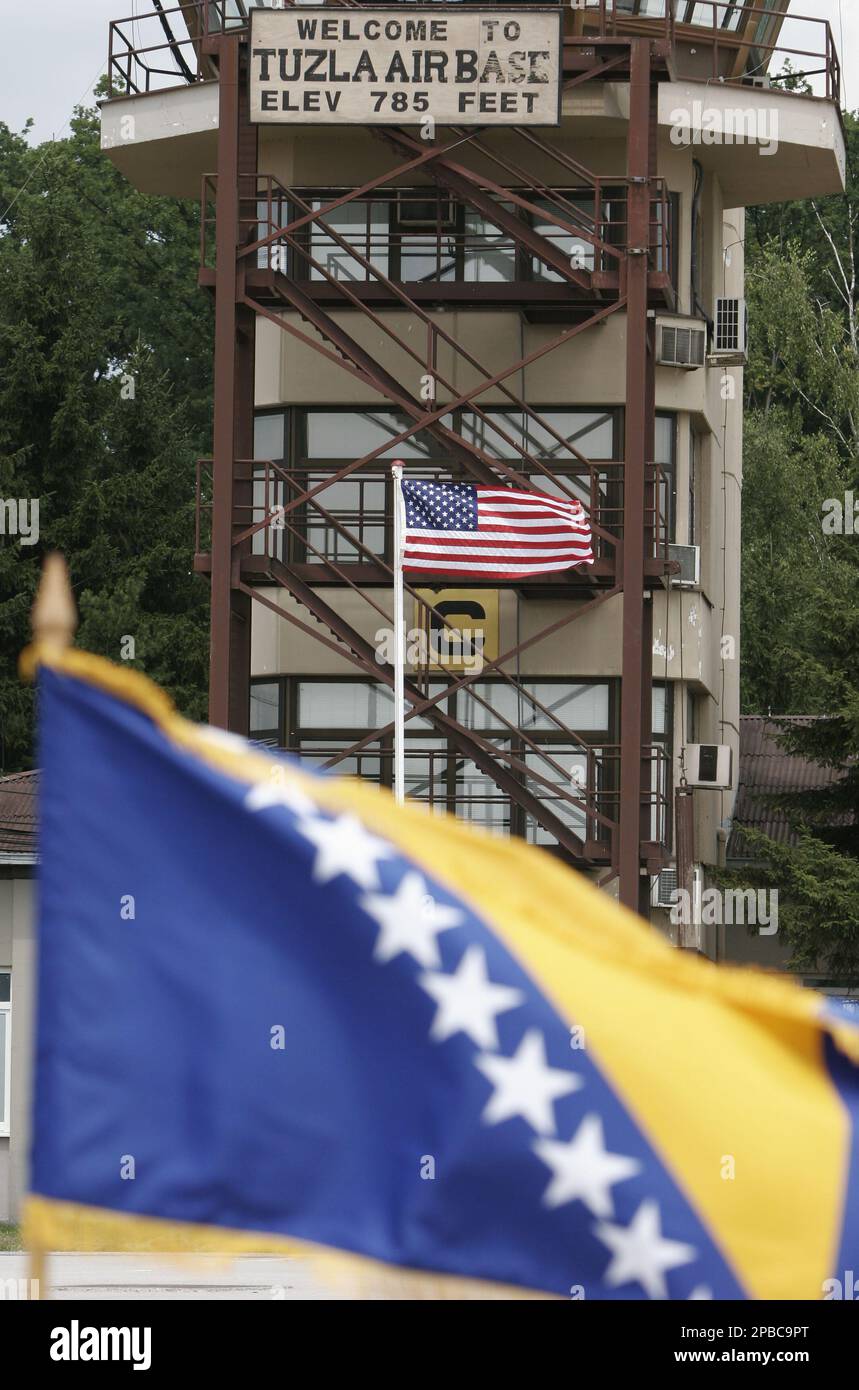 The Bosnian national flag is seen near a former air watchtower of the U ...