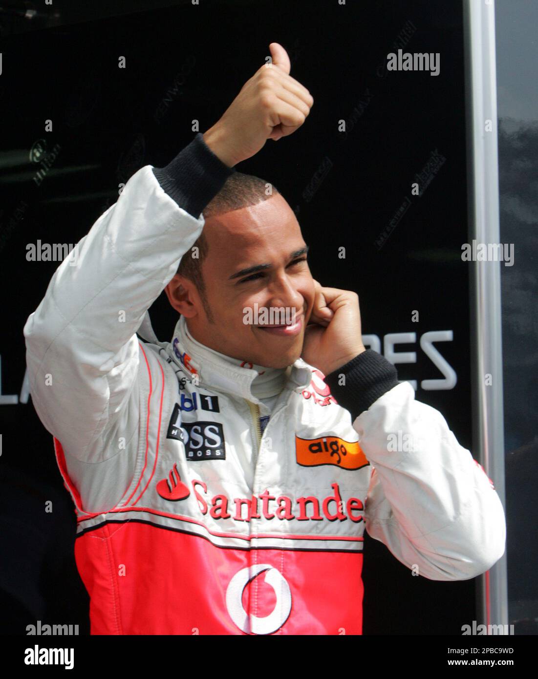 McLaren F1 driver Lewis Hamilton of Britain gives a thumbs up to ...