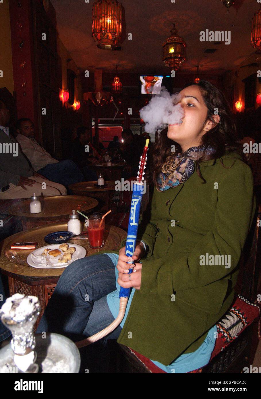 TO GO WITH TARIQ PANJI STORY --UP IN SMOKE--Zara Rahman smokes a sweet ...