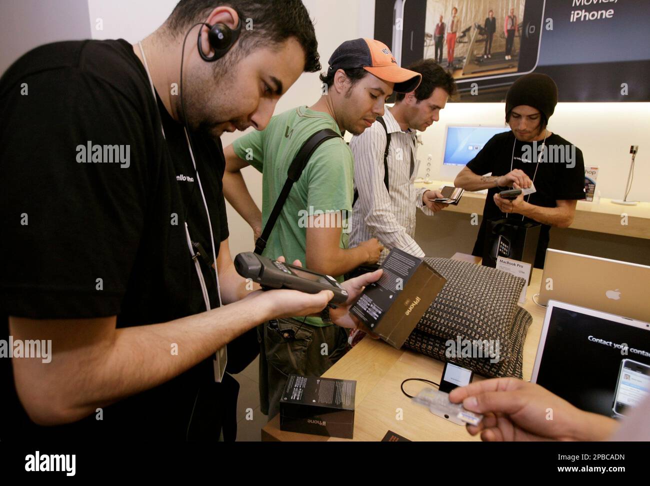 Apple cashiers rush to ring iPhones on portable credit card terminals ...