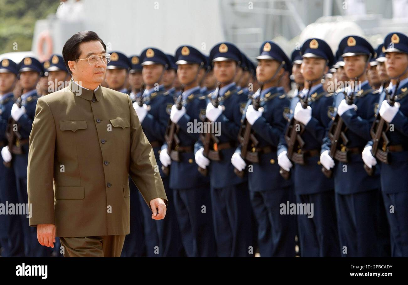 China's President Hu Jintao, left, inspects troops of the People's ...