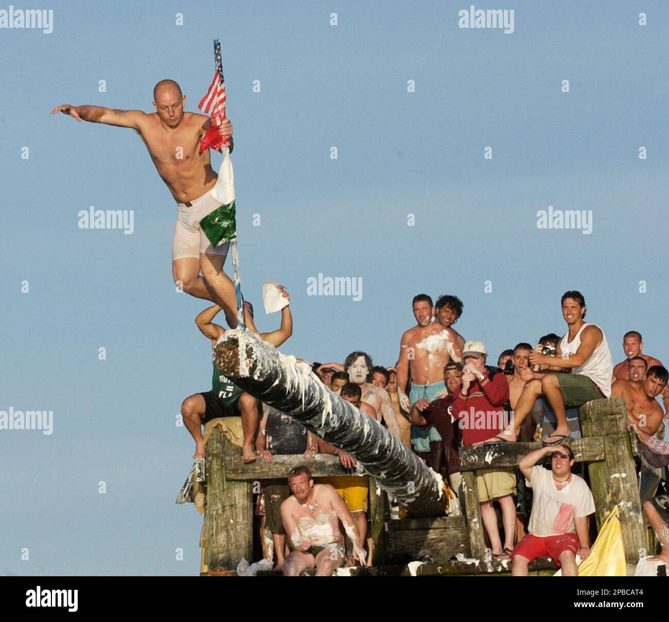 Lou Perry, of Gloucester, Mass., takes the flag and wins the Friday ...