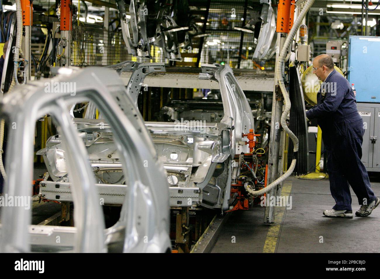 **FILE** Ford Motor Company employee Ralph Gazzillo assembles the new ...