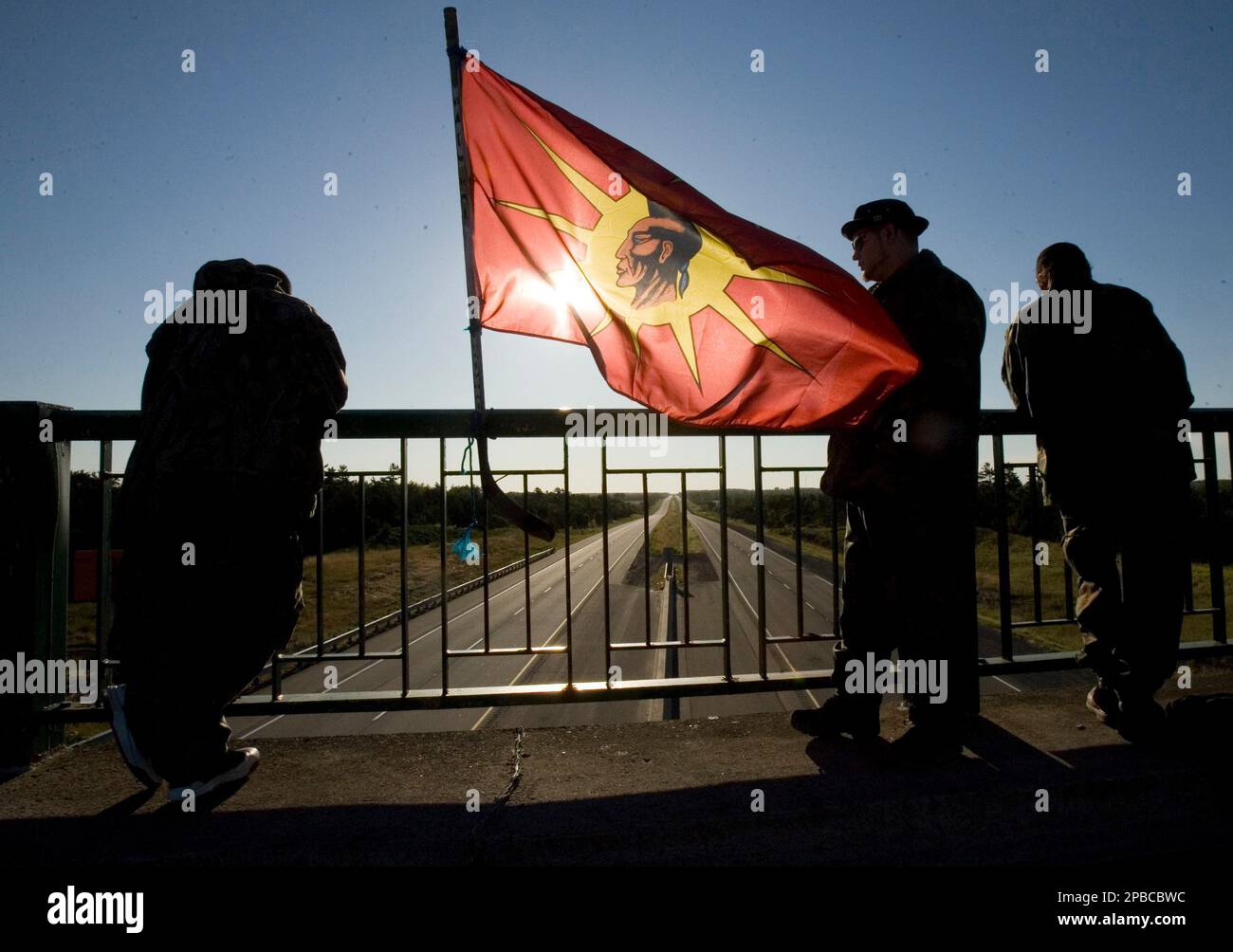 Mohawk protestors from the Bay of Quinte Mohawks stand on an overpass ...