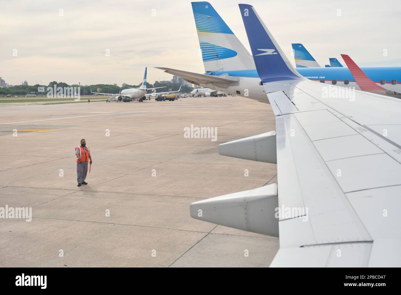 Man directing airplane hi-res stock photography and images - Alamy