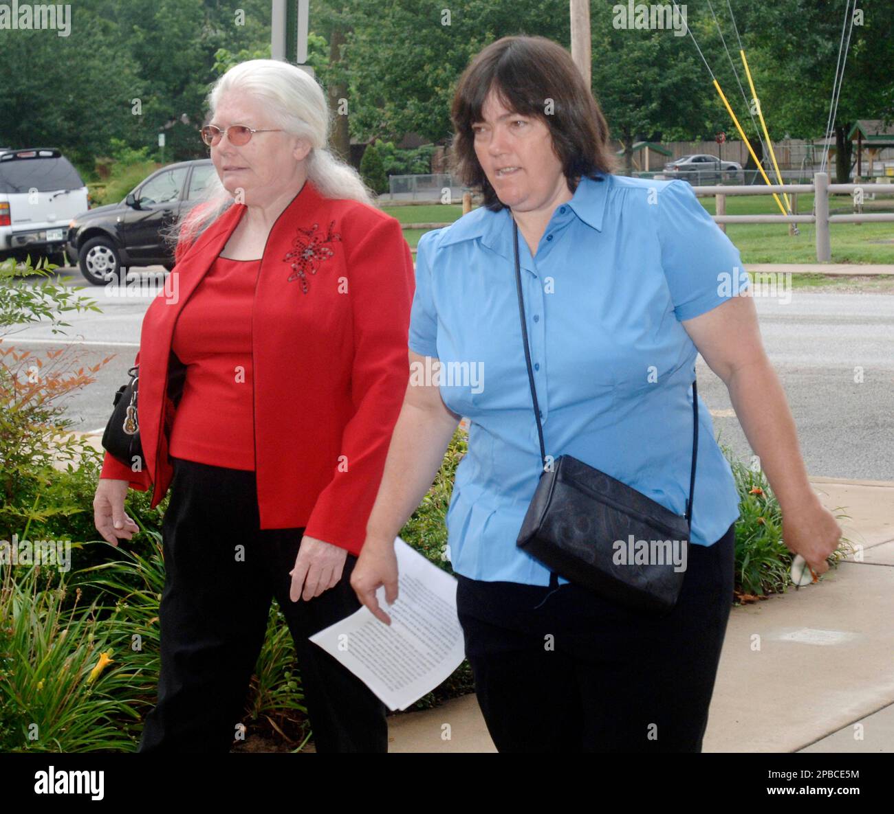 Joan Conway, left, and Mary Hamley walk to the Benton County Courthouse ...