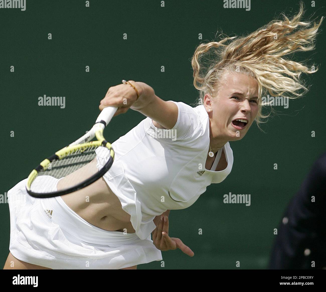 Denmark's Caroline Wozniacki serves the ball to Italy's Mara Santangelo ...