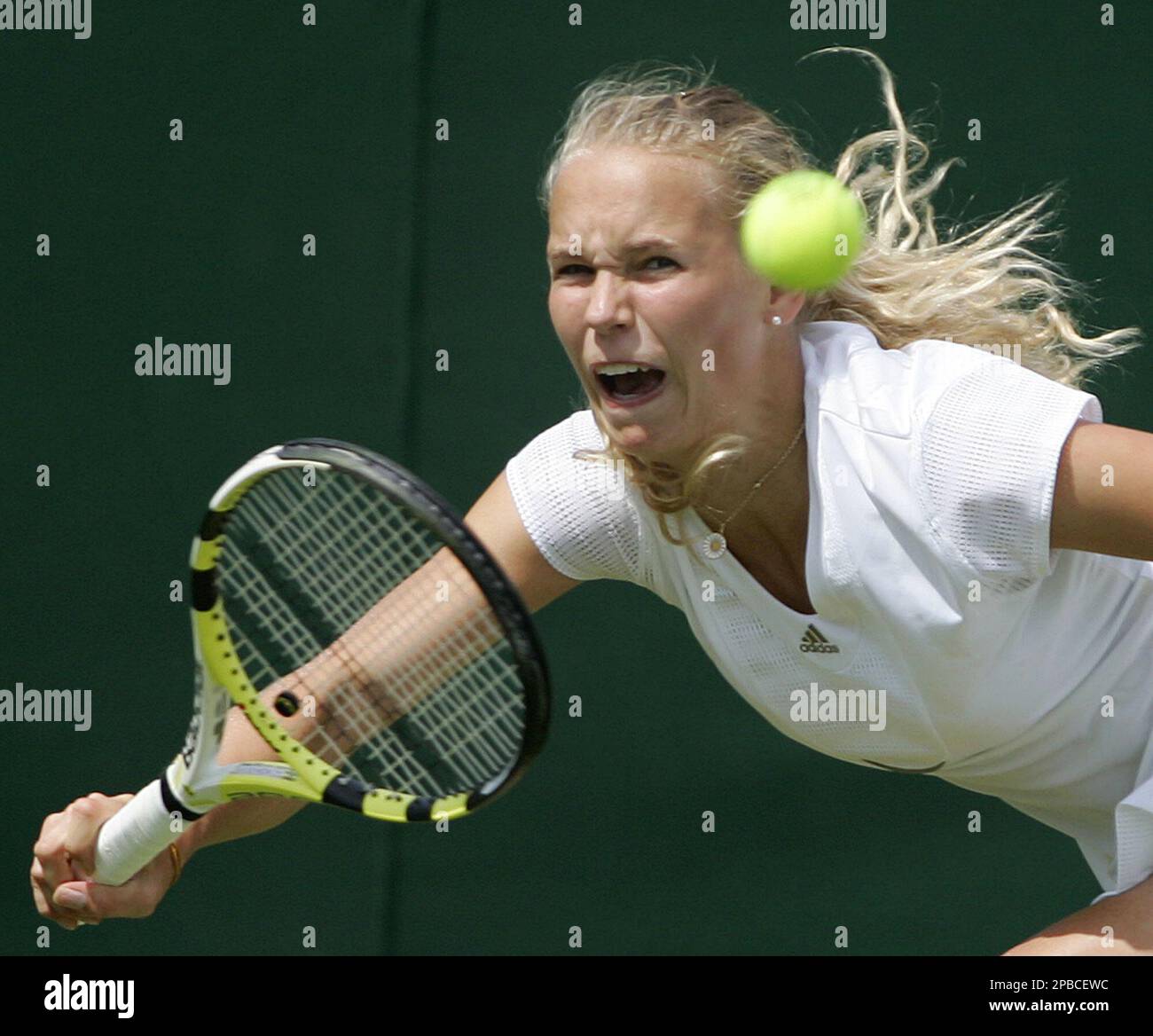 Denmark's Caroline Wozniacki returns the ball to Italy's Mara ...