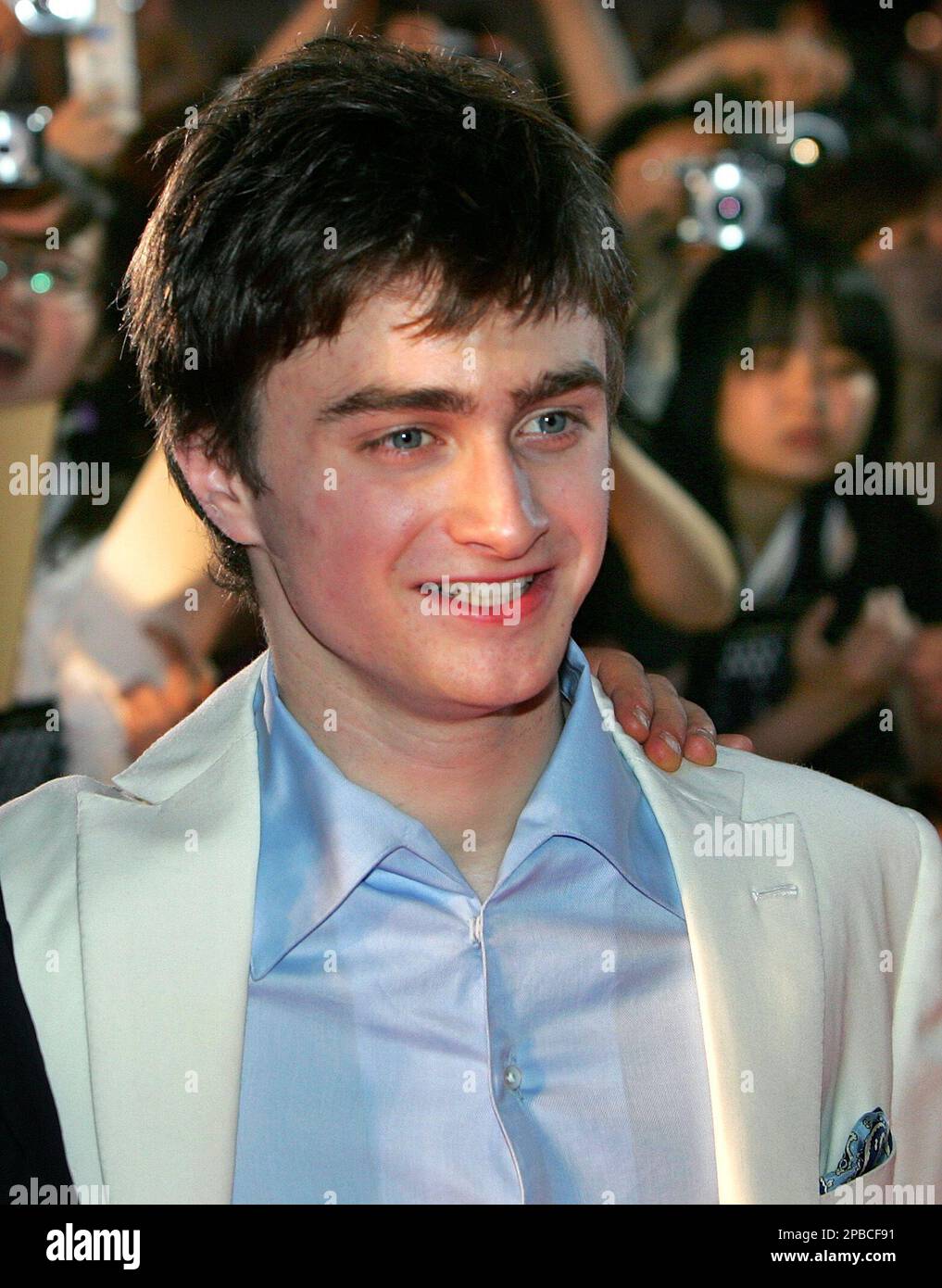 Actor Daniel Radcliffe, who stars as Harry Potter, poses for ...