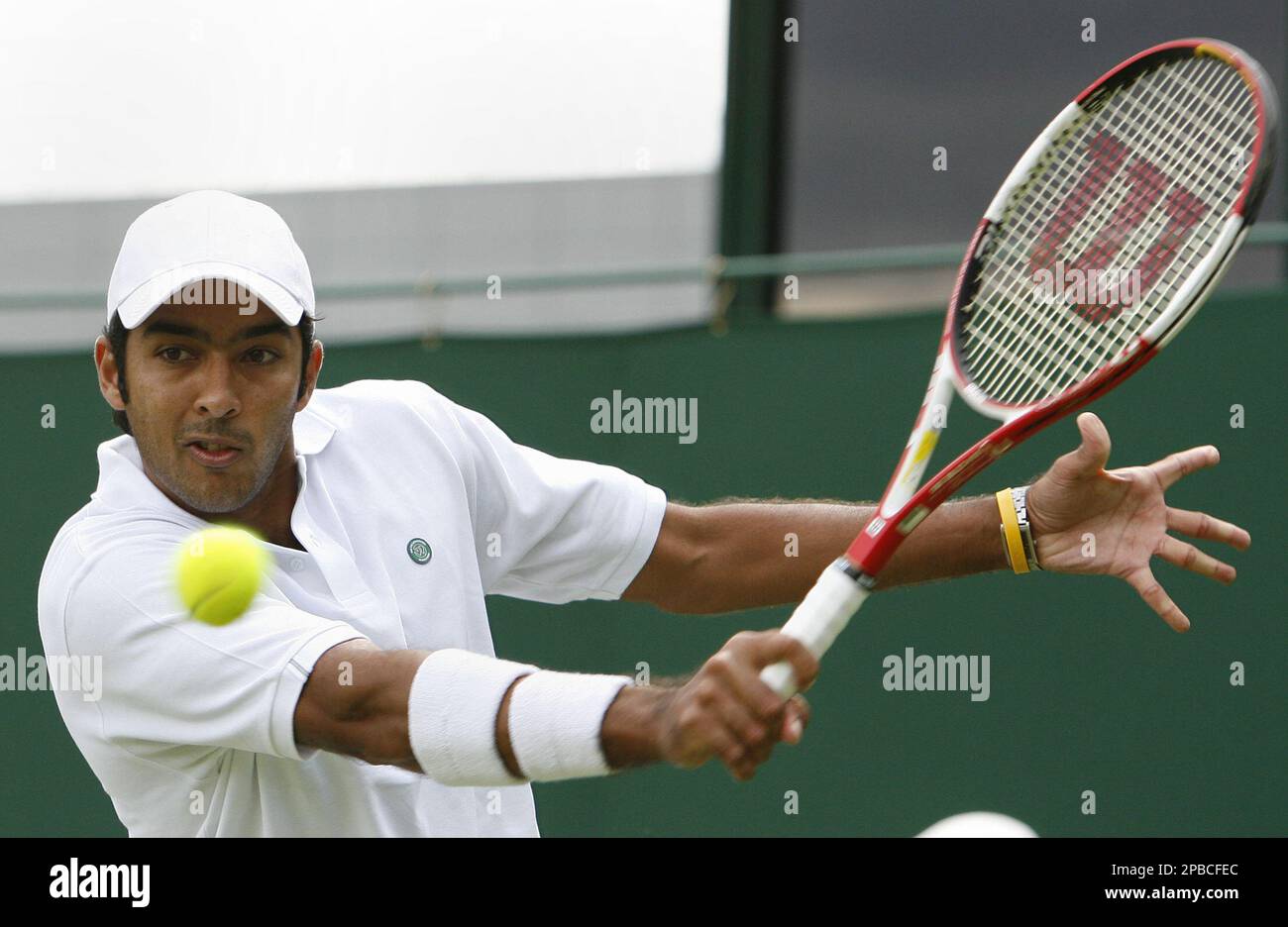 Pakistan's Aisam-Ul-Haq Qureshi returns the ball to Russia's Marat ...