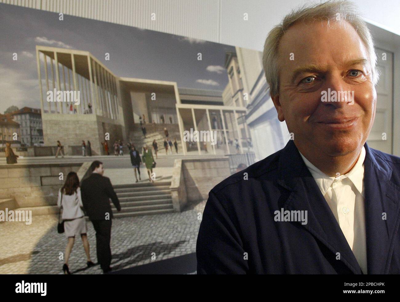 British architect David Chipperfield poses in front of a of a computer ...