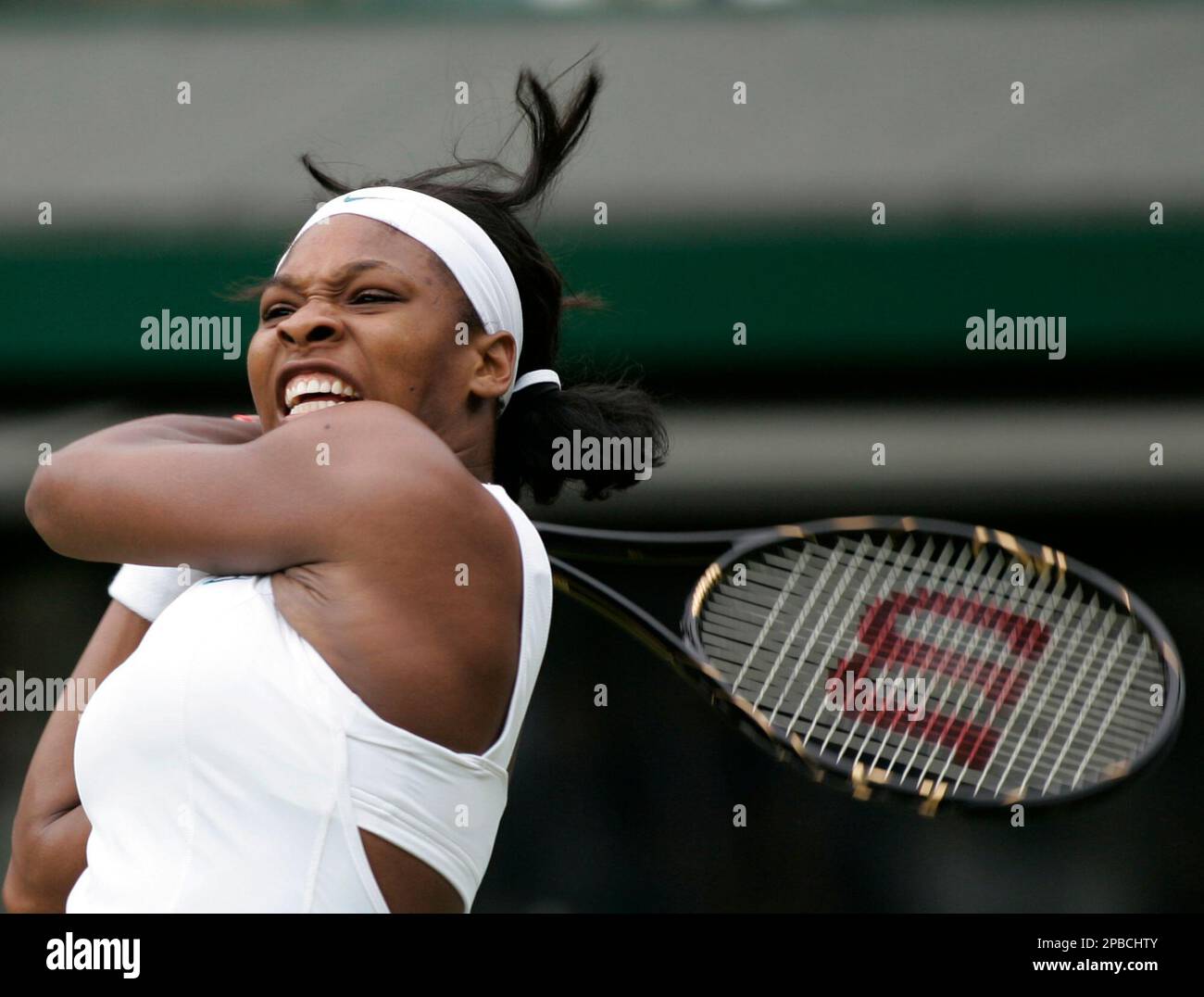Serena Williams serves to Alicia Molek of Australia, mduring their ...