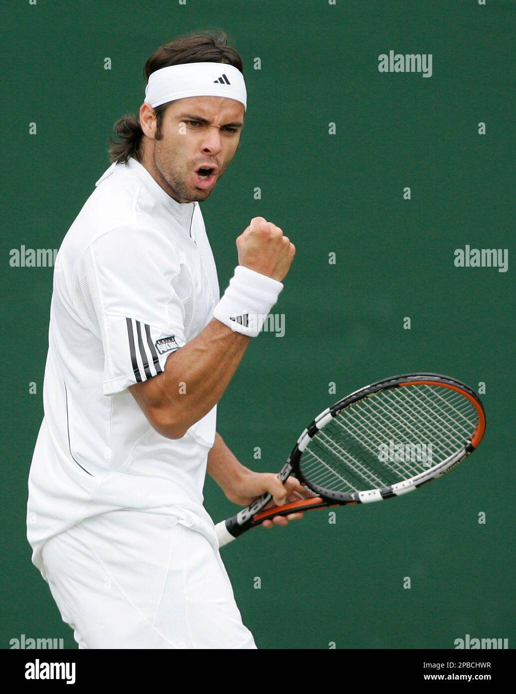 Chile's Fernando Gonzalez reacts as he plays Alejandro Falla of ...