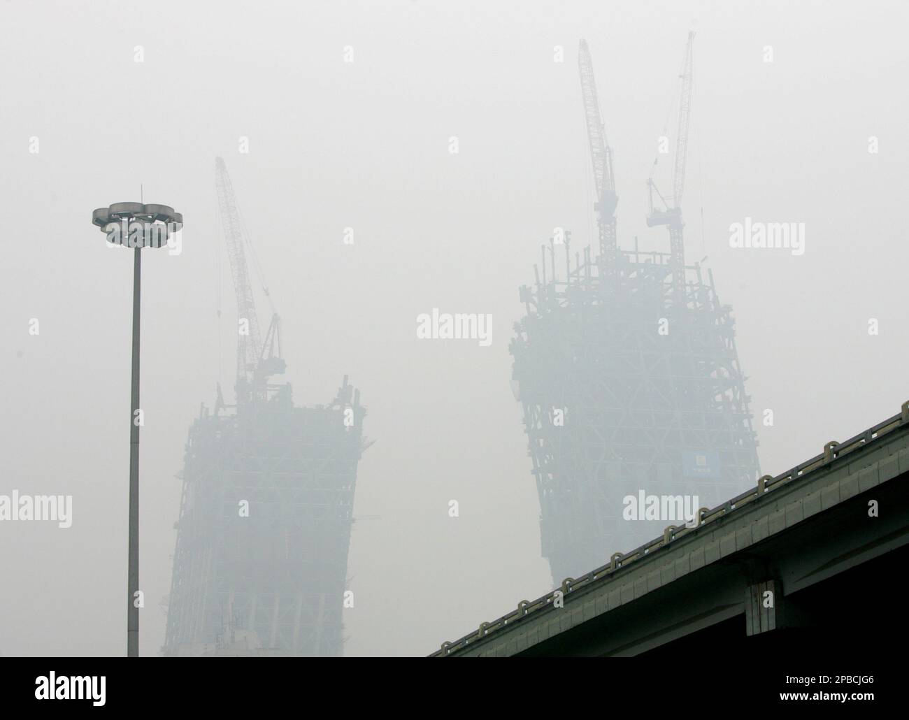 The leaning towers of the China Central Television headquarters loom ...