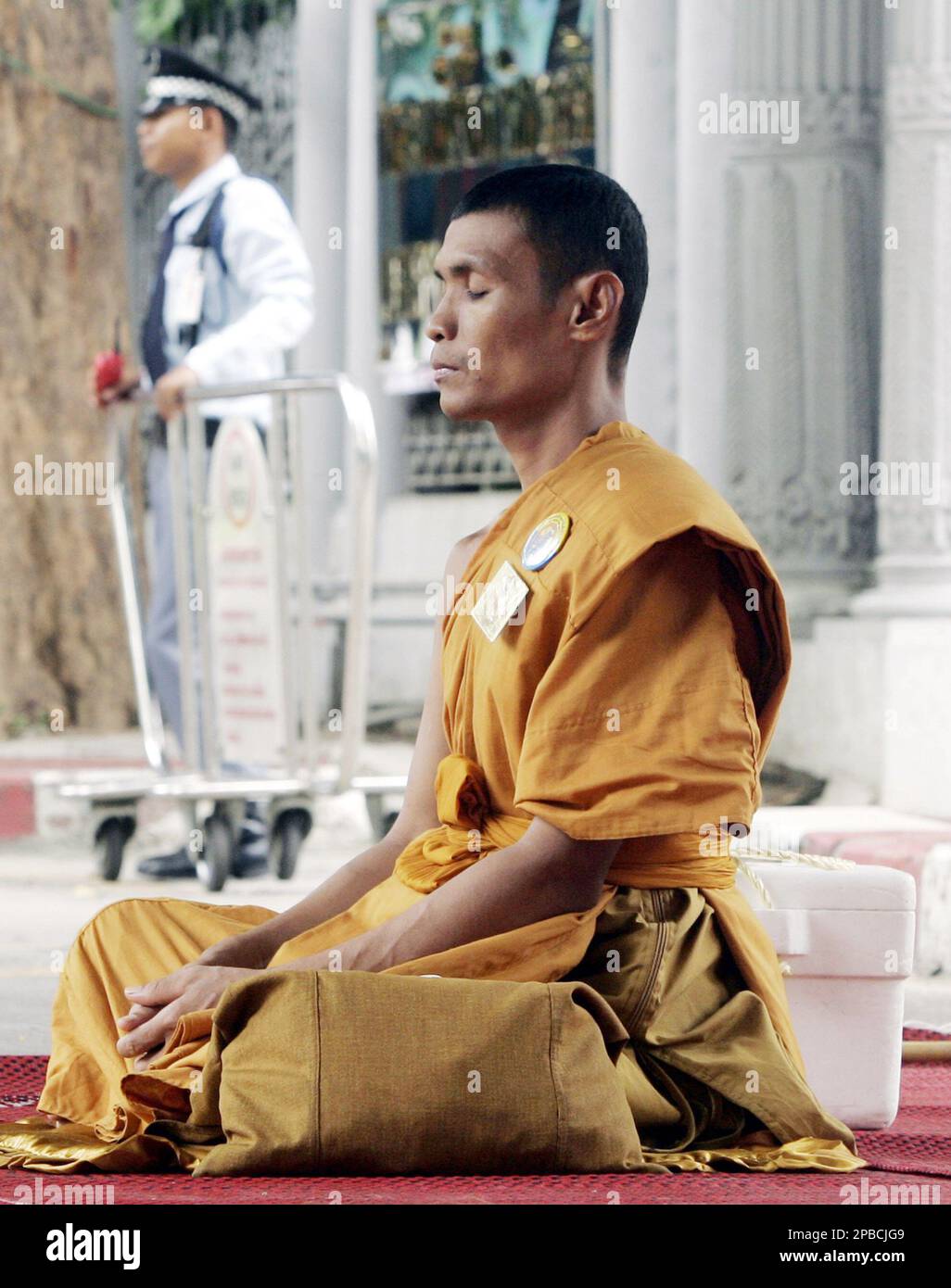 A Buddhist monk practices meditation during a protest outside ...