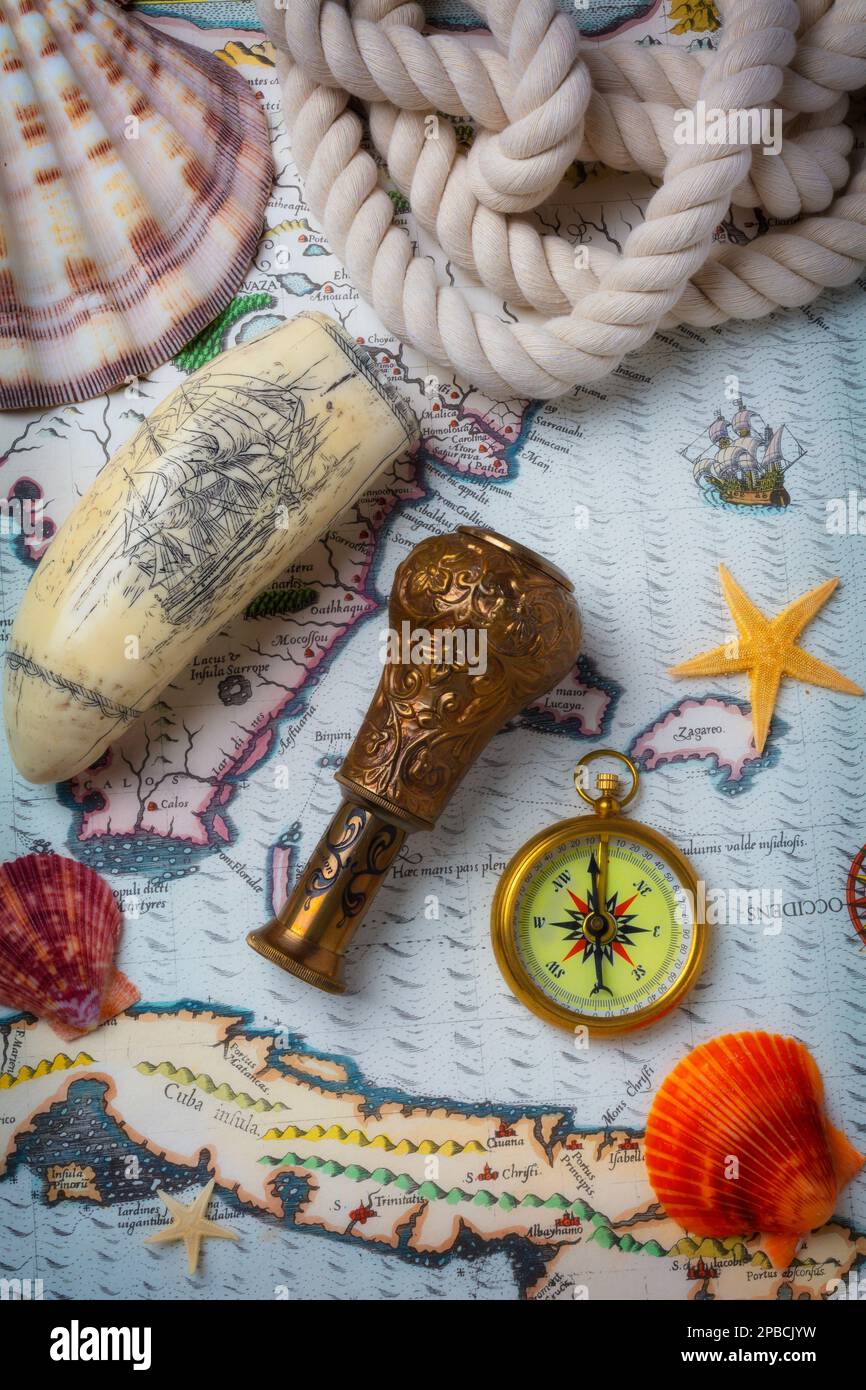 Antique Spy Scope And Compass On Old Map With SEashells And Scrimshaw ...