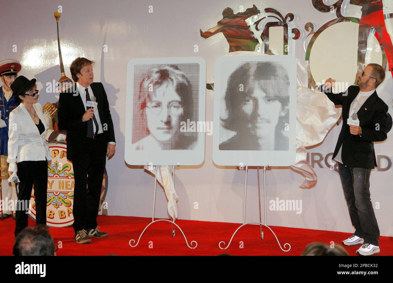 Yoko Ono Lennon, from left, Paul McCartney and Ringo Starr, unveil plaques honoring John Lennon ...
