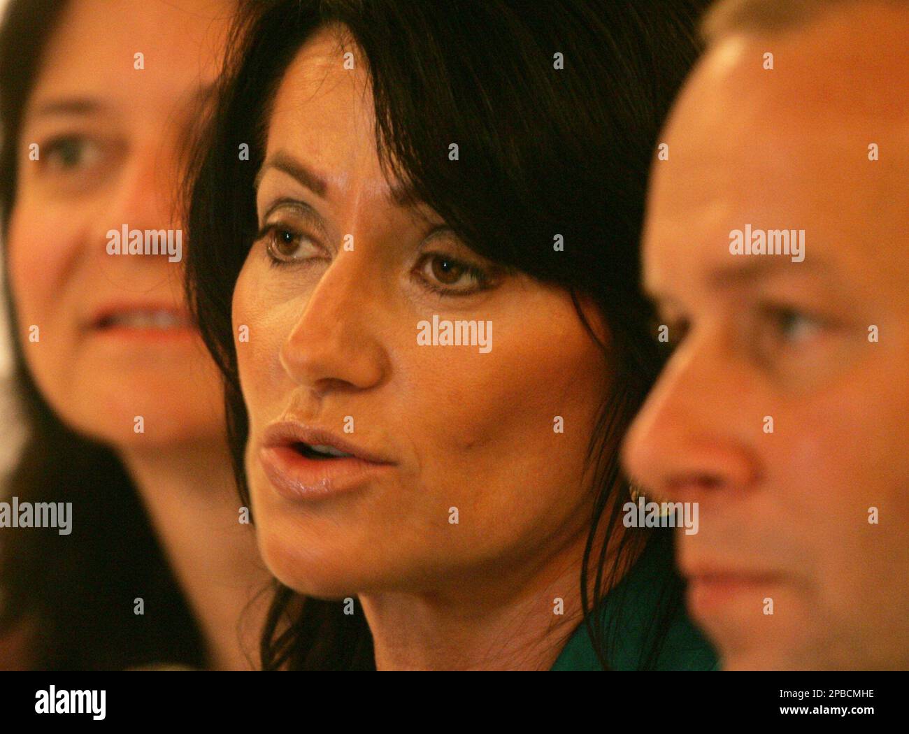 Former Romanian Olympics Gymnastics champion Nadia Comaneci, center ...