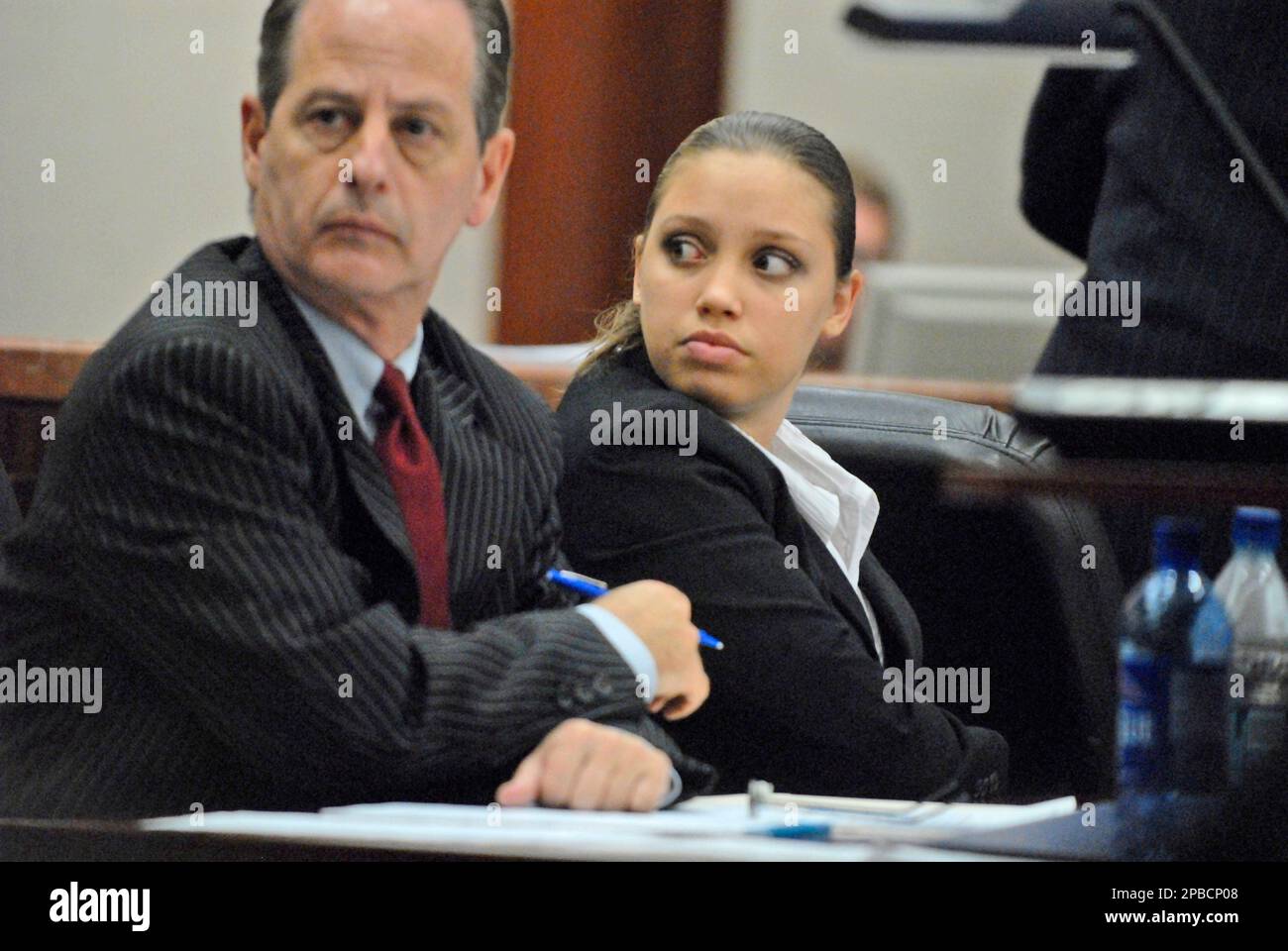 As her attorney Brian Wice looks to his right, 17-year-old Ashley ...