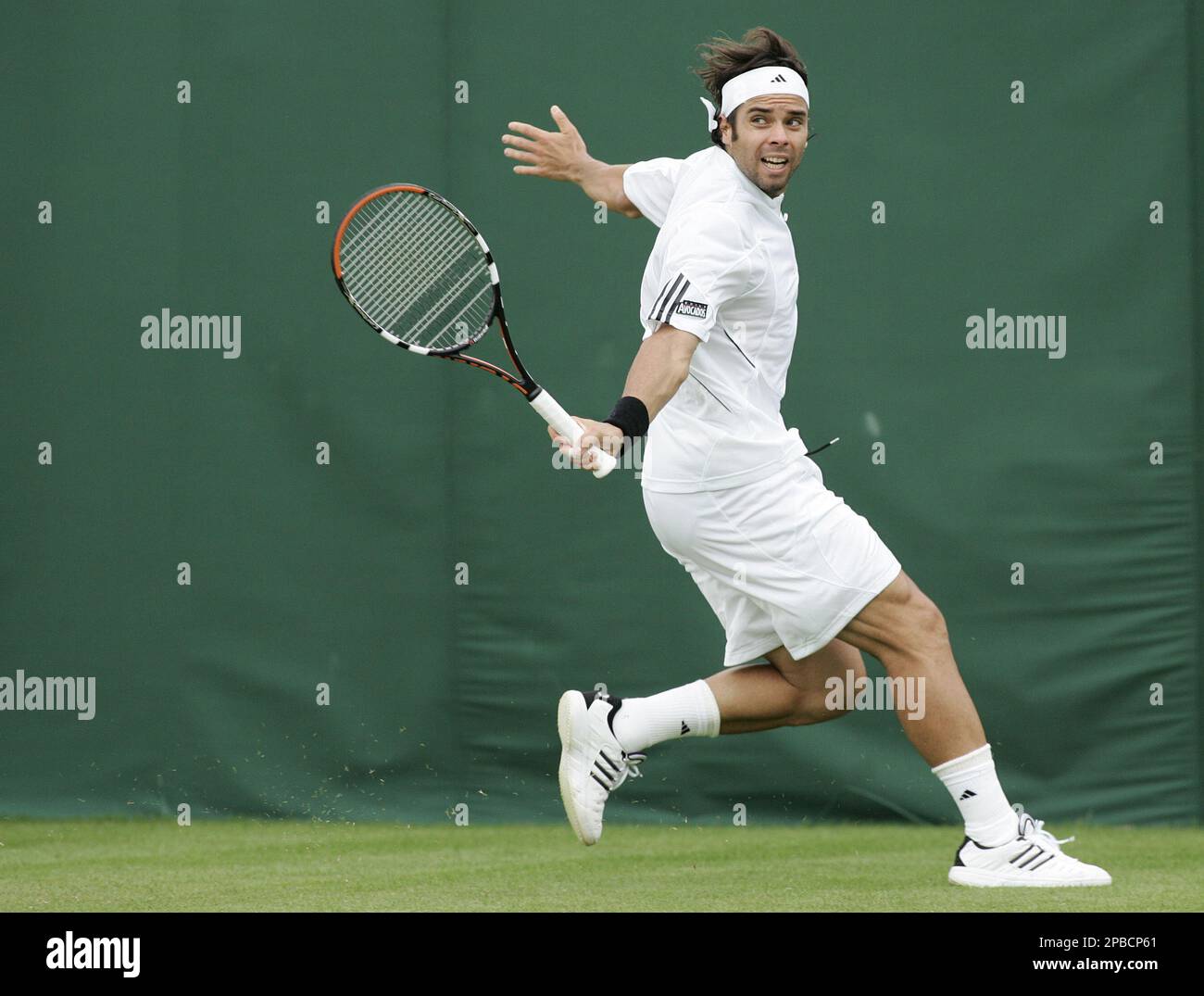 Chile's Fernando Gonzalez returns the ball during his men's singles ...