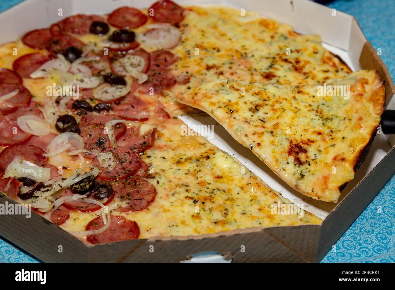 Traditional Brazilian pizza half pepperoni sausage and half four ...