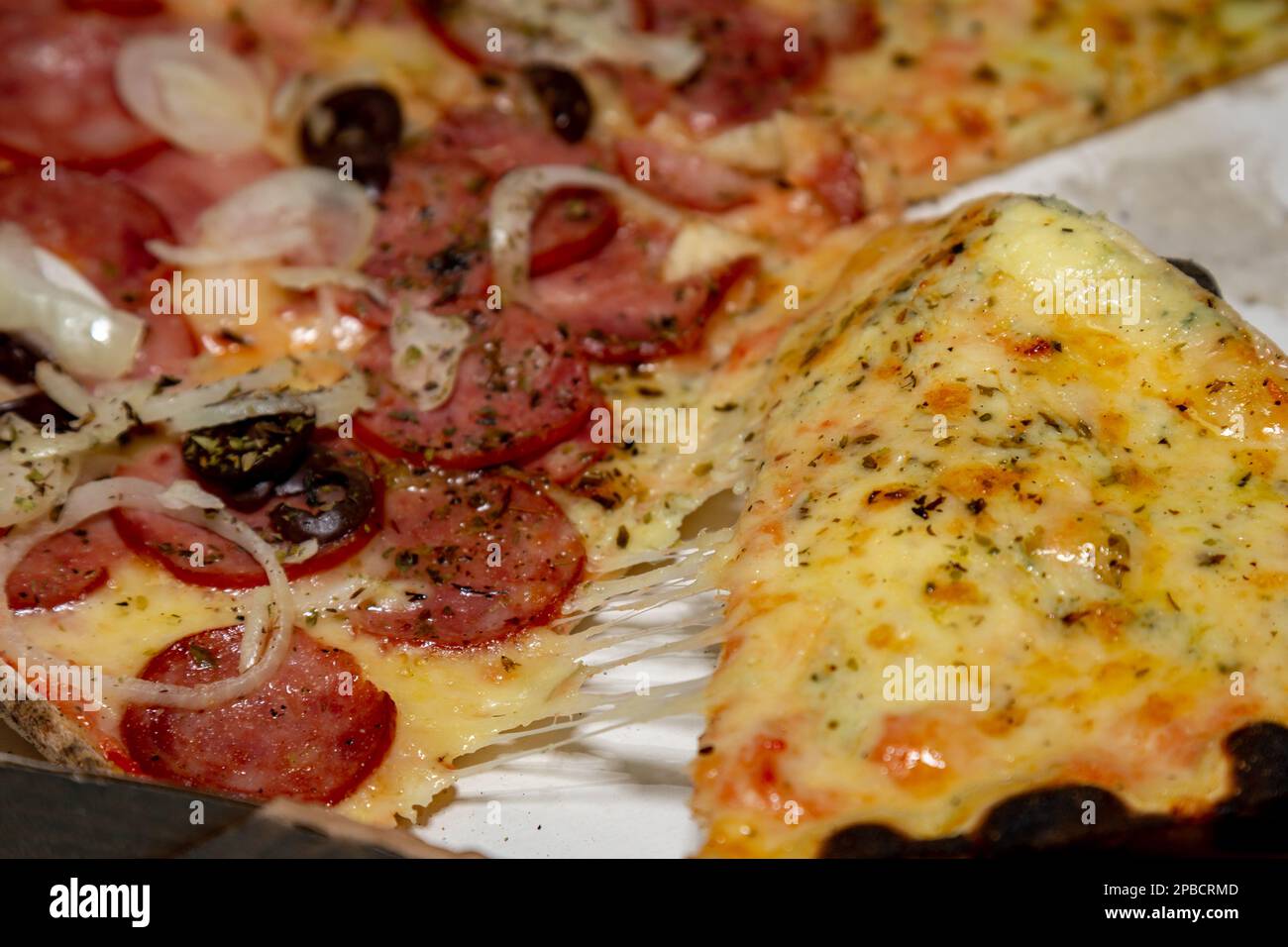 Traditional Brazilian pizza half pepperoni sausage and half four ...