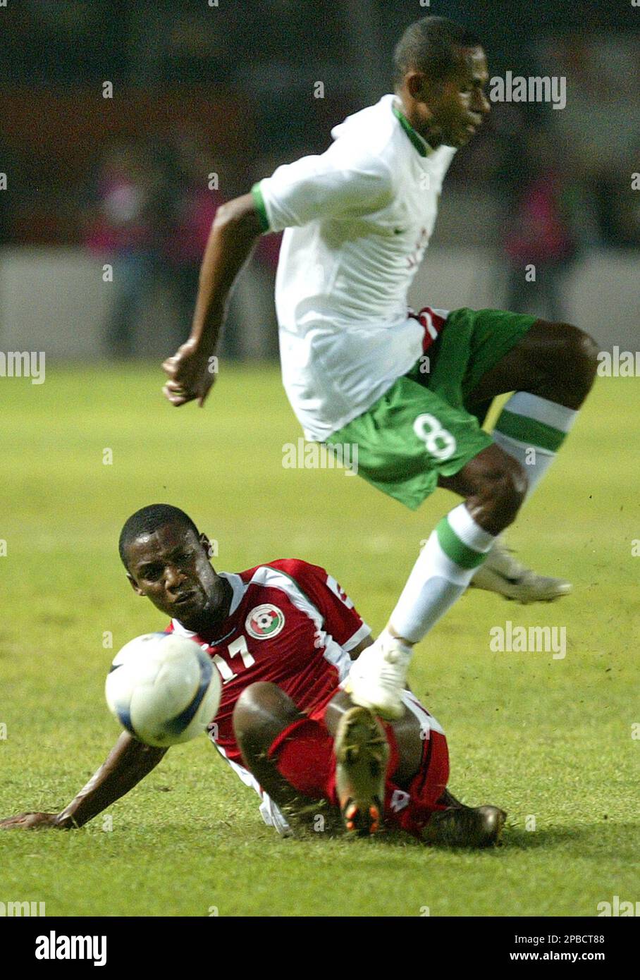 Indonesia's Elie Aiboy, right, battles for the ball with Oman's ...
