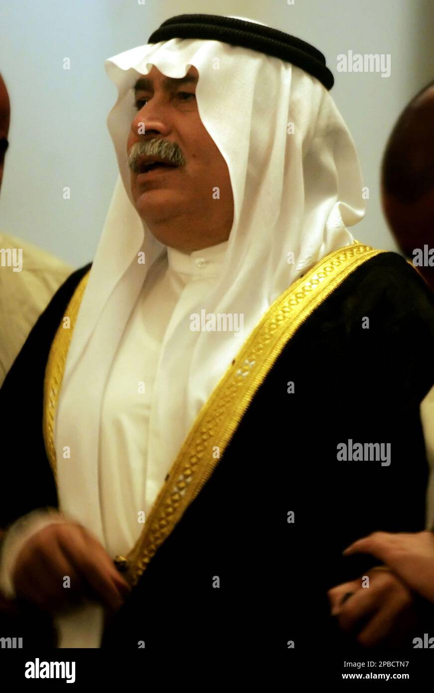 Sultan Hashim Ahmad al-Tai reacts as court officials conduct him out of ...