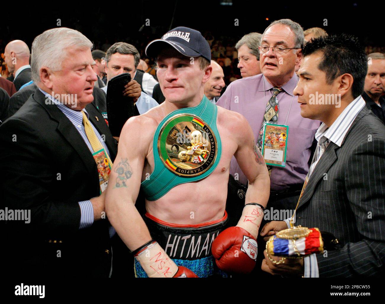 Boxer Ricky Hatton, center, of England, wears a champion belt after ...