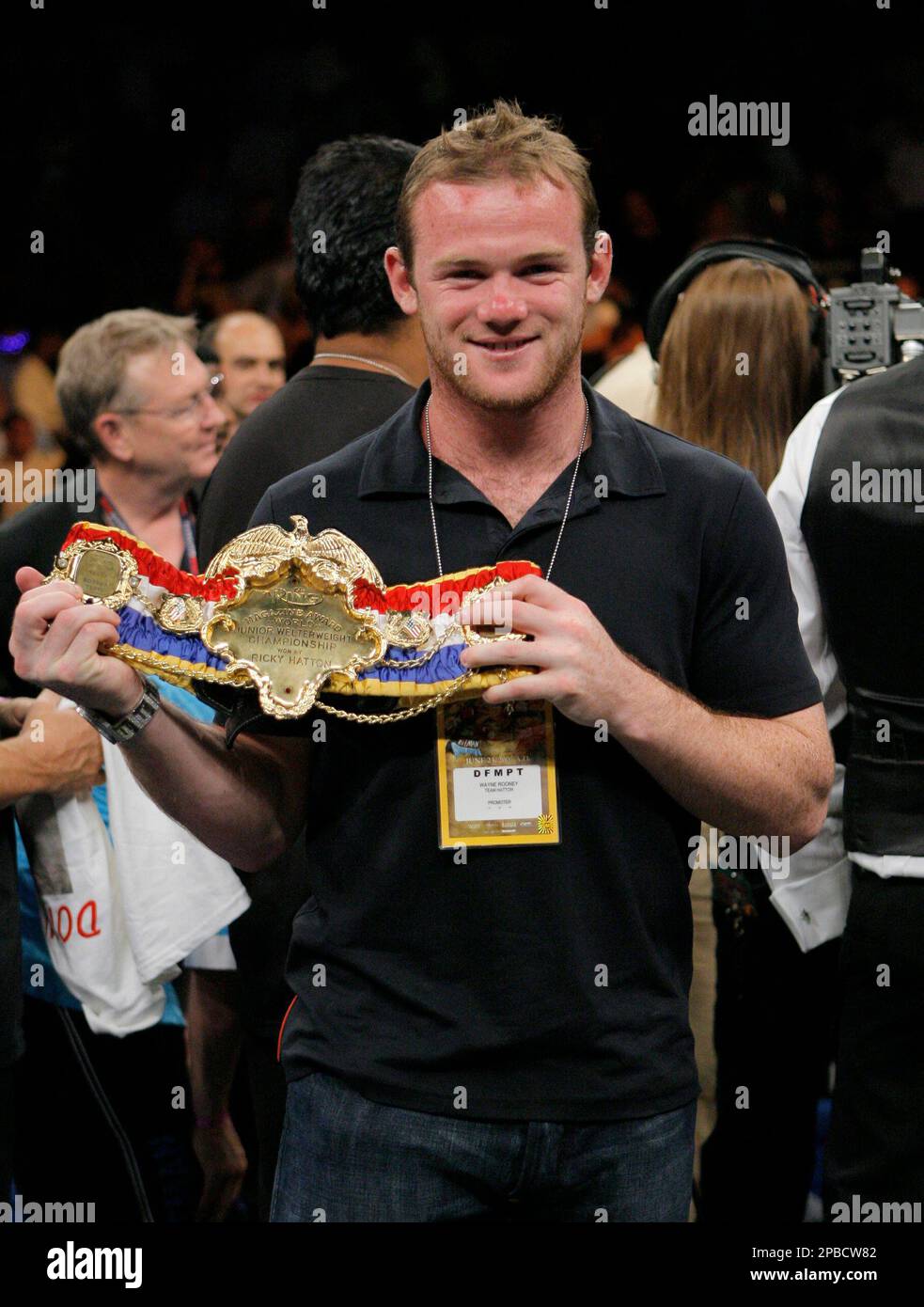 Soccer player Wayne Rooney, of Britain, poses with boxer Ricky Hatton's ...