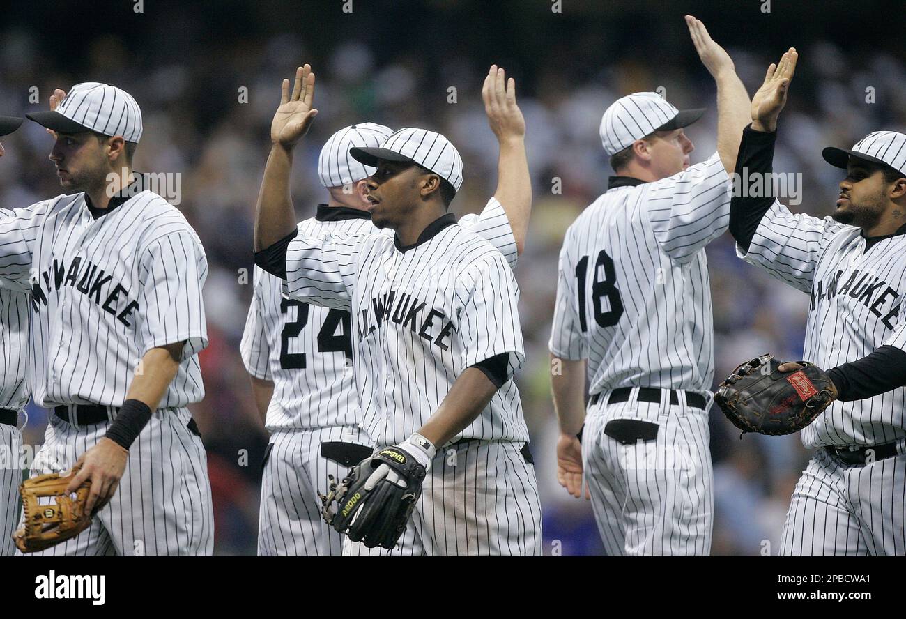 Milwaukee Brewers, from left, Ryan Braun, Kevin Mench, partially ...