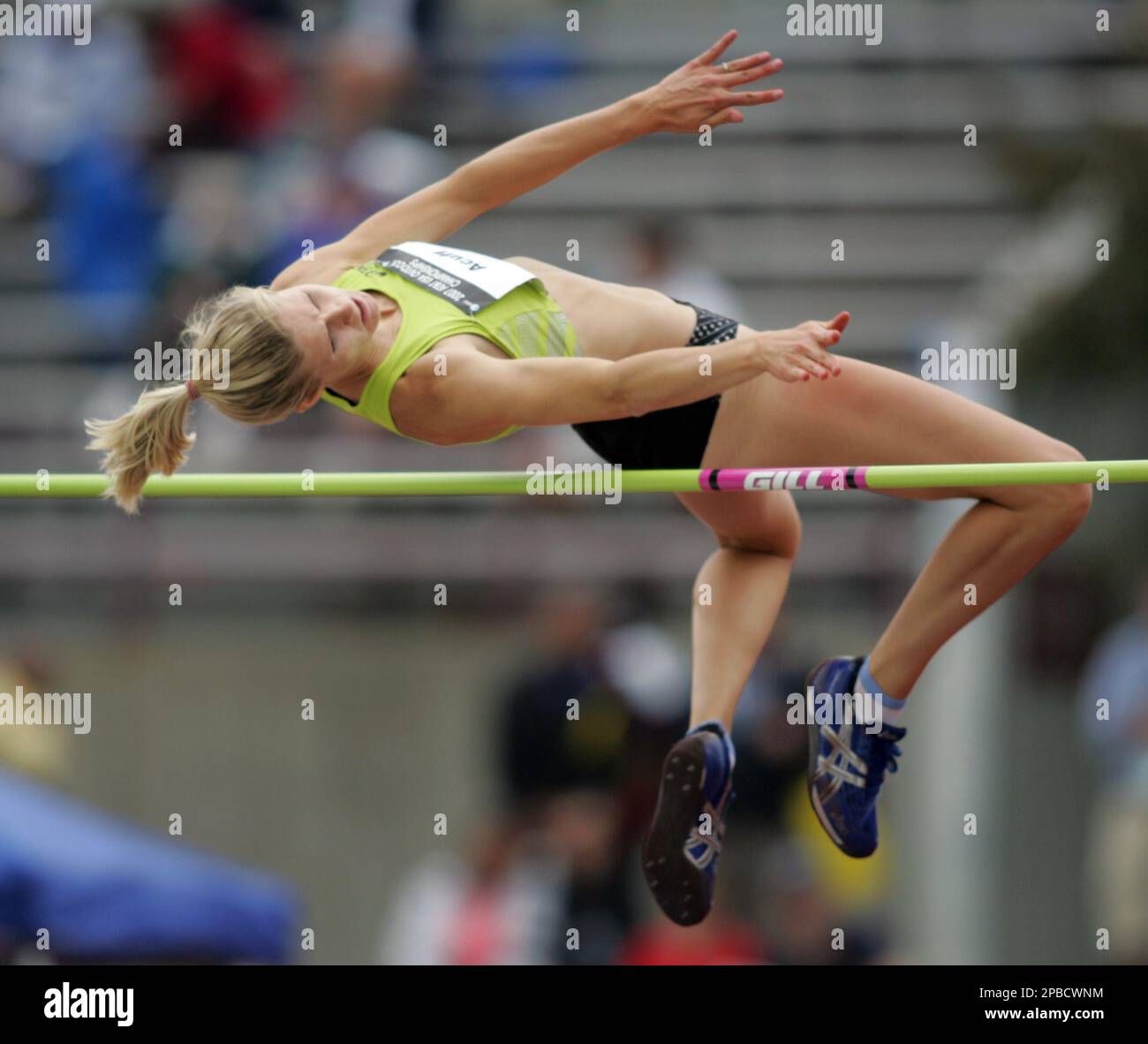 Amy Acuff clears the bar during the finals of the women's high jump at ...