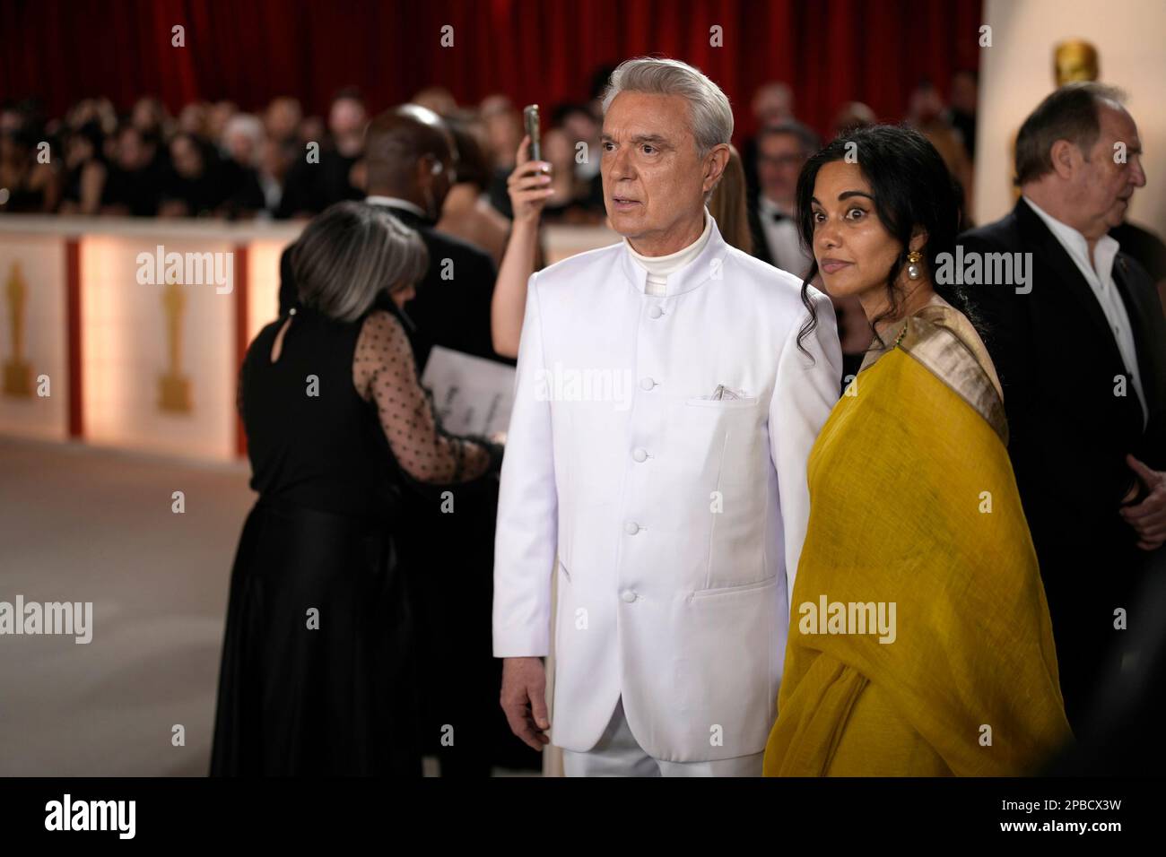 David Byrne, left, and Mala Gaonkar arrive at the Oscars on Sunday ...