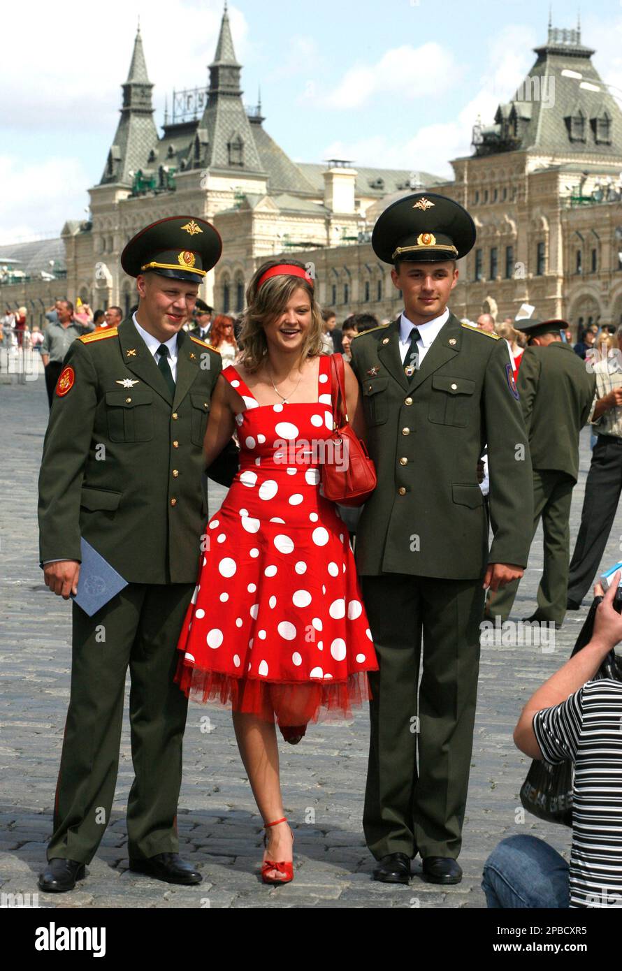 Russian officers pose for a photo after a graduation ceremony on Red ...