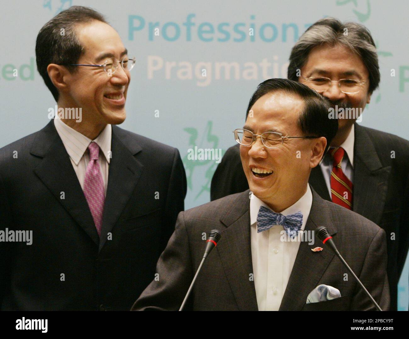 Hong Kong Chief Executive Donald Tsang, center, laughs with his new ...