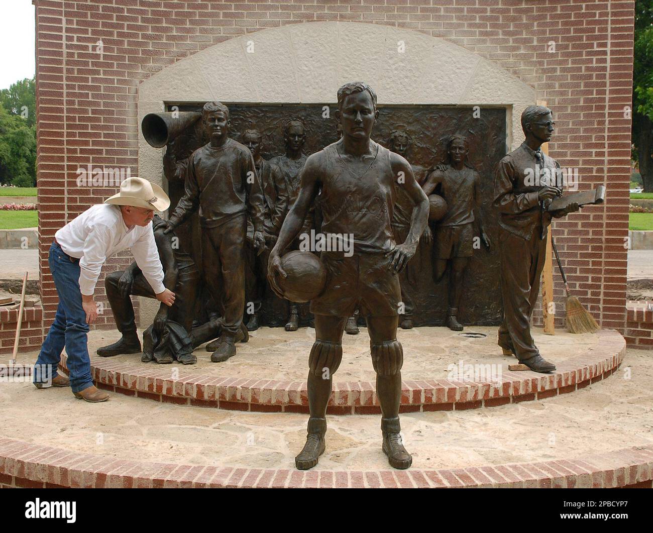 Noted artist Bruce Greene looks over his life-sized bronze statues ...