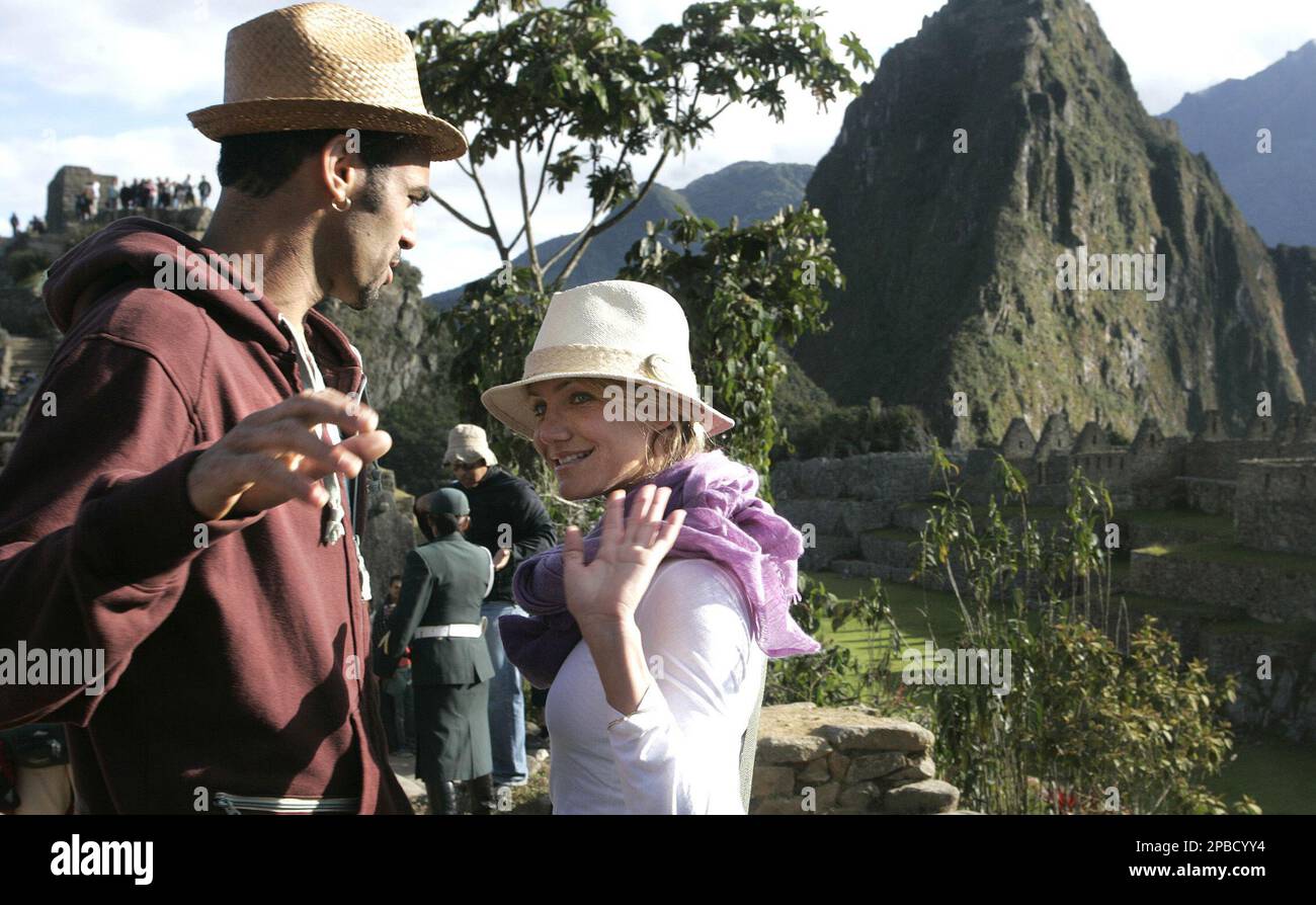 US actress Cameron Diaz, right, greets photographers as she walks with ...