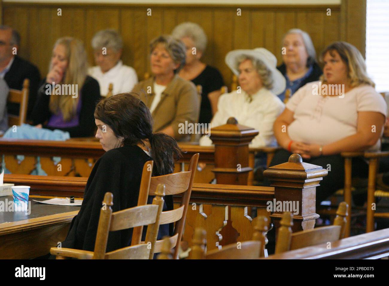 Actress Mary Scripps, foreground, plays the part of accused murderer ...