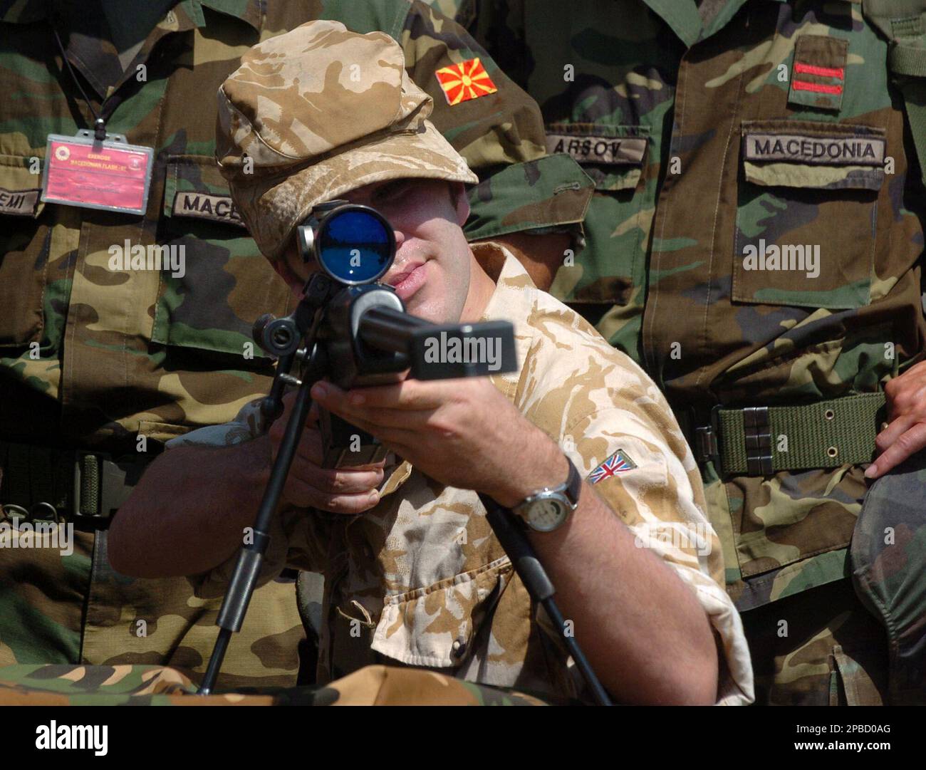 A British soldier aims with a sniper used by Macedonian Army, during a ...