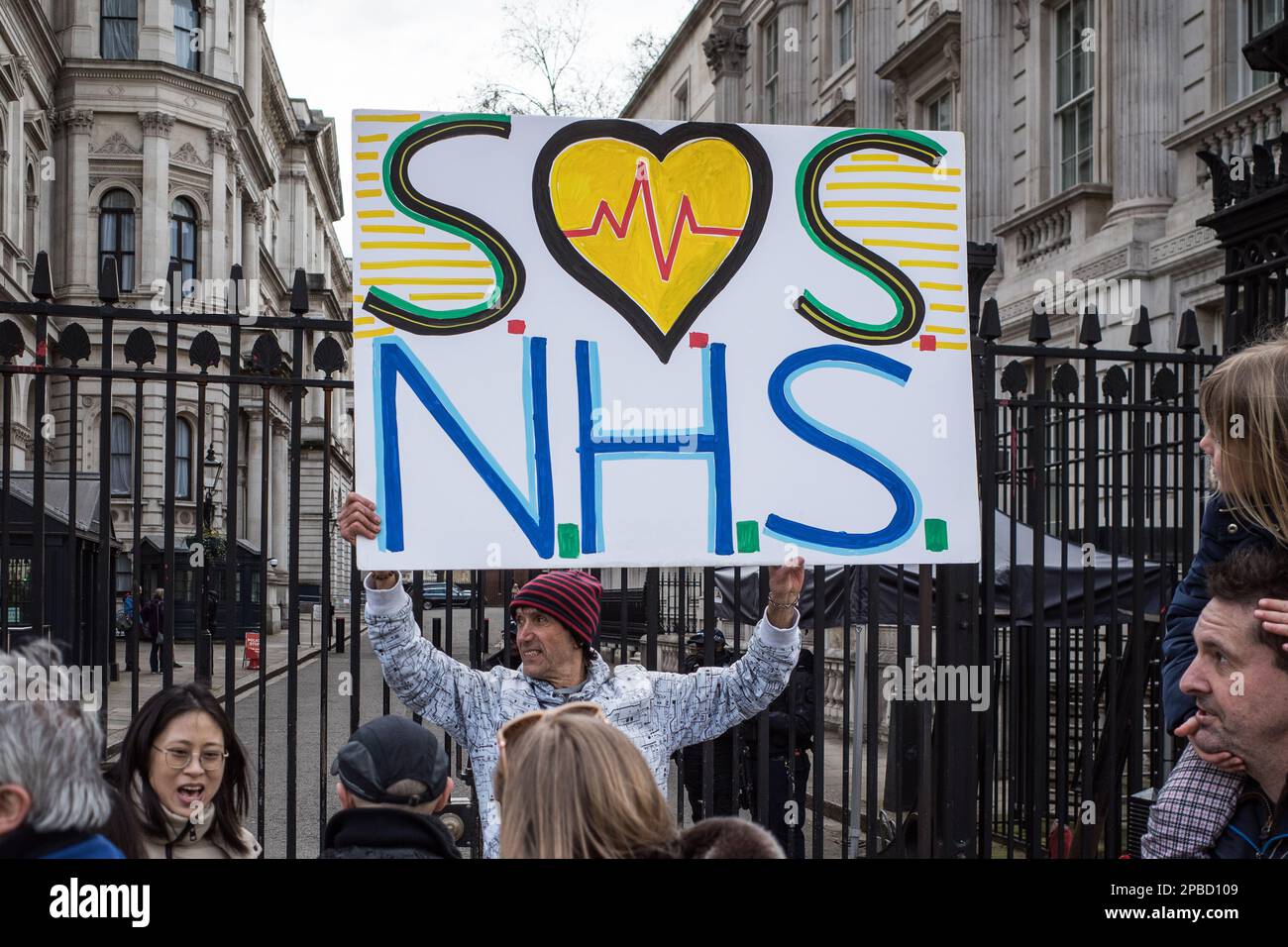 Man holds up 'SOS NHS' Placard outside 10 Downing Street during the NHS ...