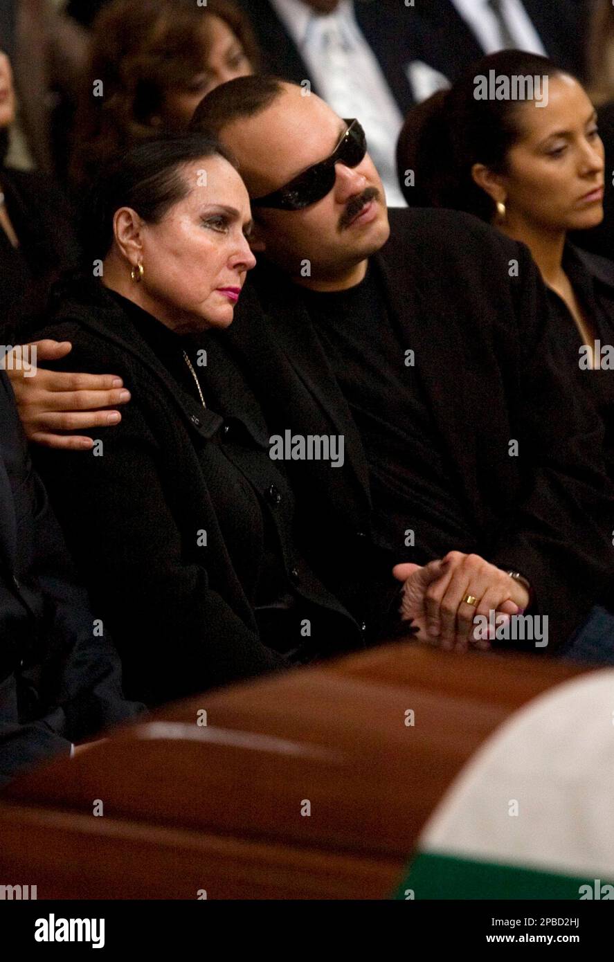 Mexican singer Pepe Aguilar, center, embraces his mother Flor Silvestre ...