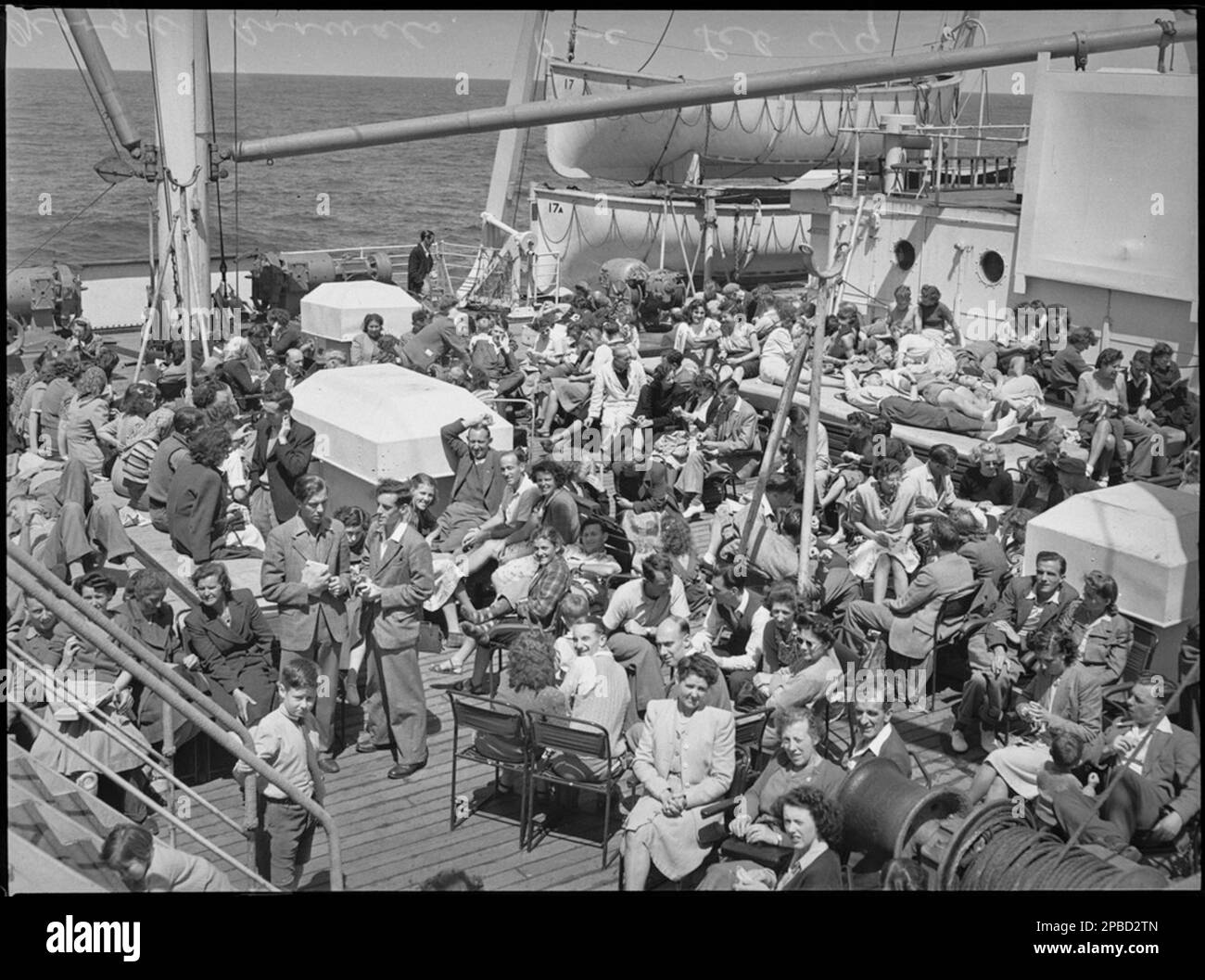 British migrants on the deck of the Georgic, bound for Australia, 1949 ...