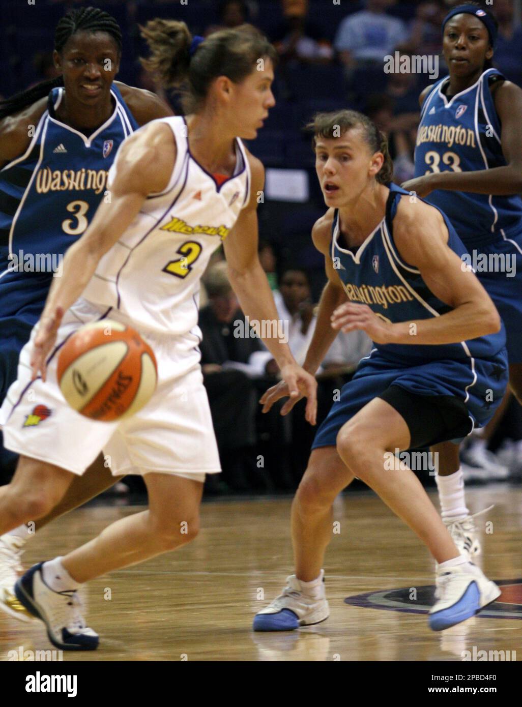 Washington Mystics guard Coco Miller, second from right, defends her ...