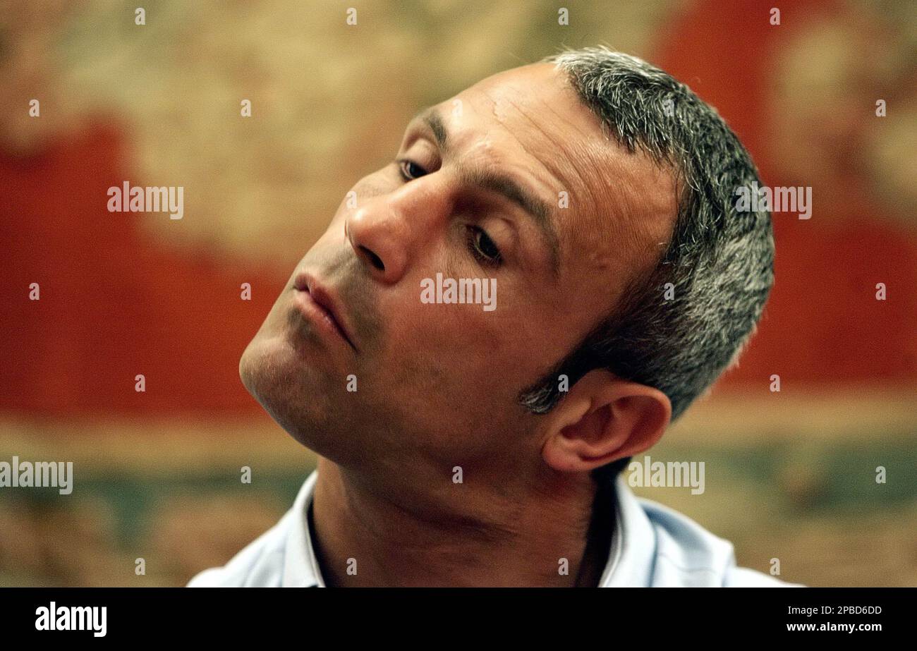 Italian boxer Vincenzo Cantatore stretches his neck during a press ...