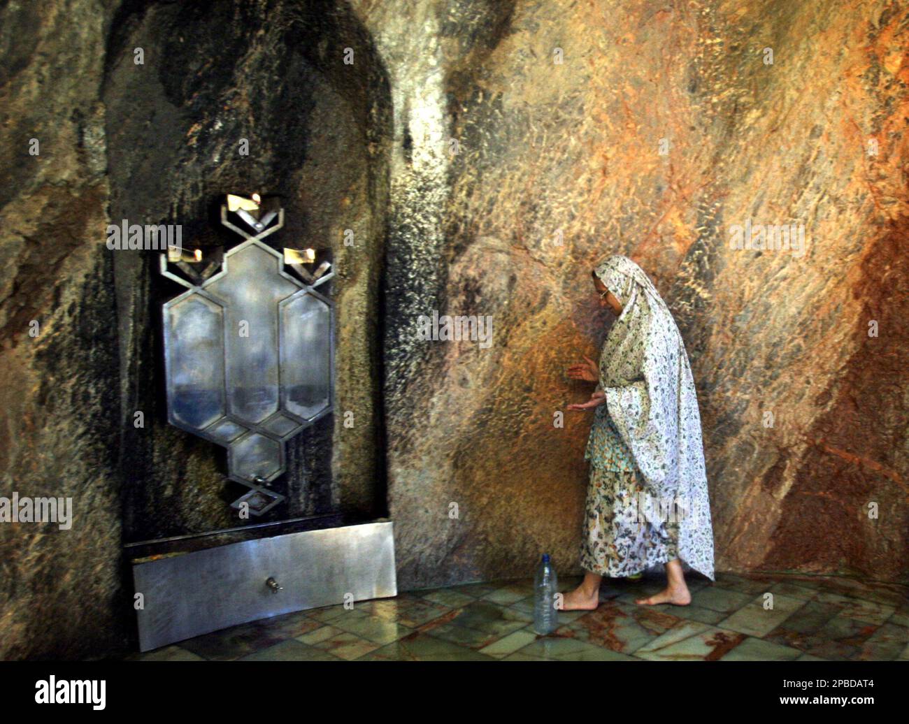 An Iranian Zoroastrian woman, prays during the annual 5-day celebration ...