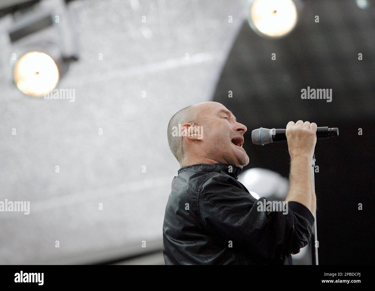 British Singer Phil Collins sings during a concert of the band Genesis ...