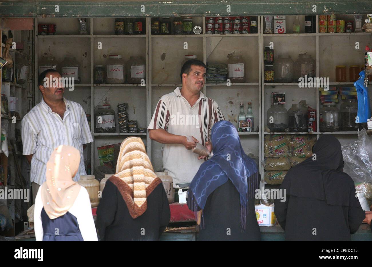 Iraqi women shop at the Dora market in southern Baghdad, Iraq, Sunday ...