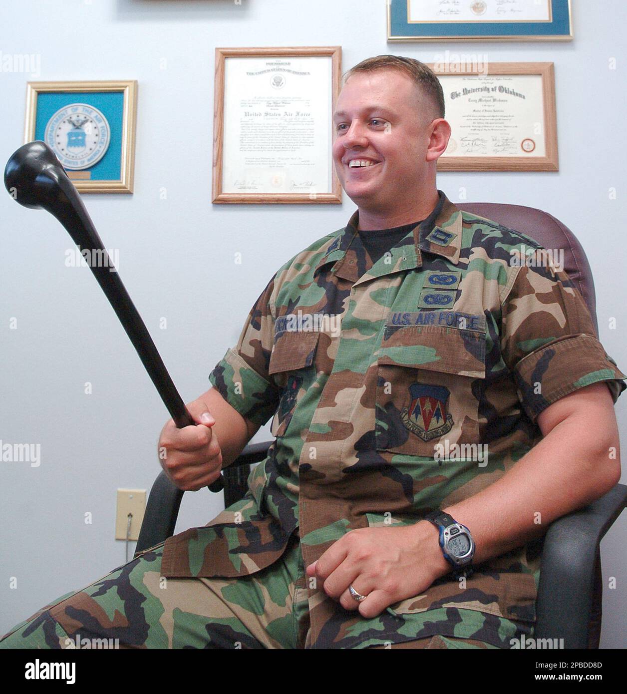 Capt. Tony Wickman, public affairs chief at Vance Air Force Base, holds ...