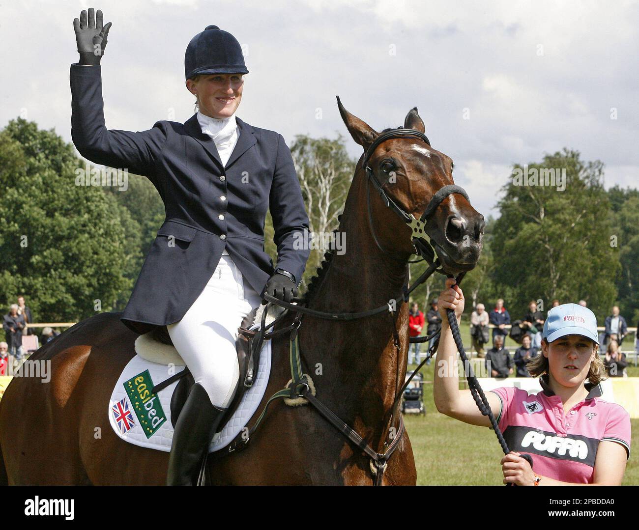 Great Britain's Ruth Edge waves to spectators after she won with her ...