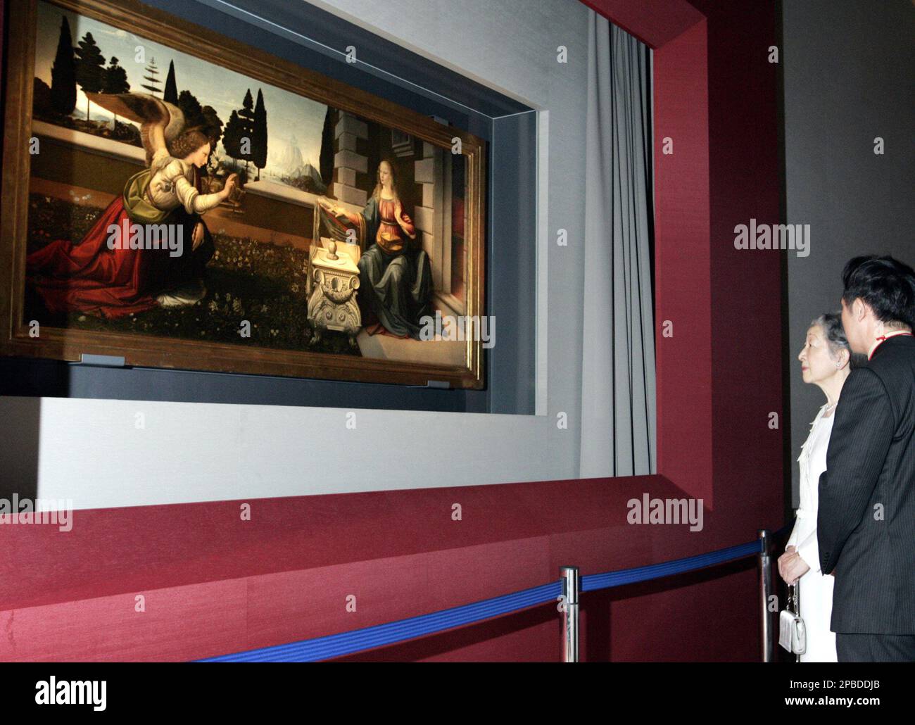 Japan's Empress Michiko, left, looks at "Annunciation", a painting done ...